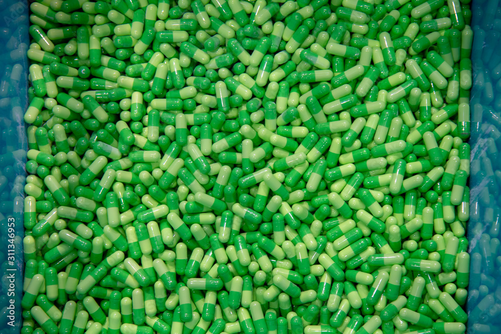 The capsule drugs in the container box between pharmaceutical ...