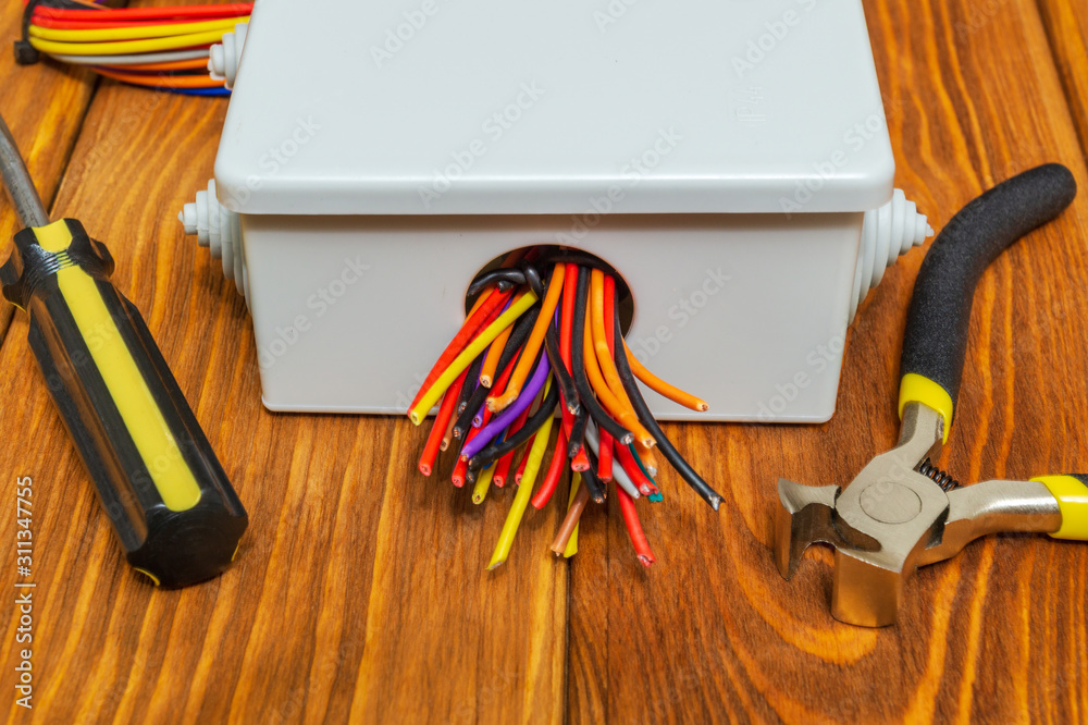 Electrical junction box with cables wire and tools used in the electric ...