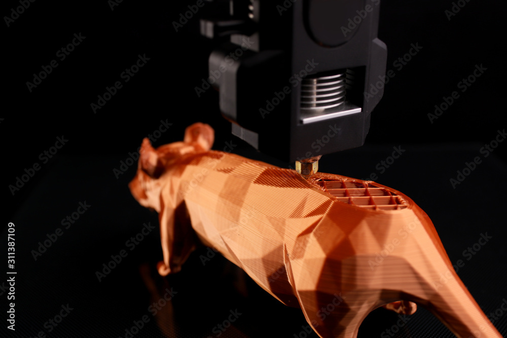 closeup on print head of a 3D-printer manufacturing back of rat ...