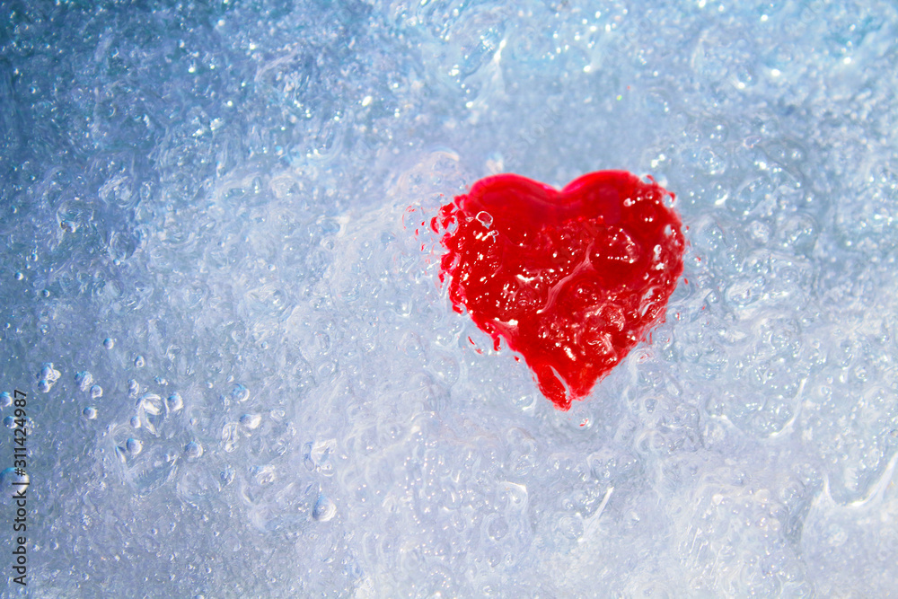 Red heart in ice. Close-up. Background. Texture. Stock Photo | Adobe Stock