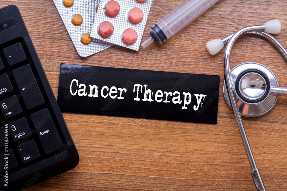Cancer Therapy words written on label tag with medicine,syringe ...