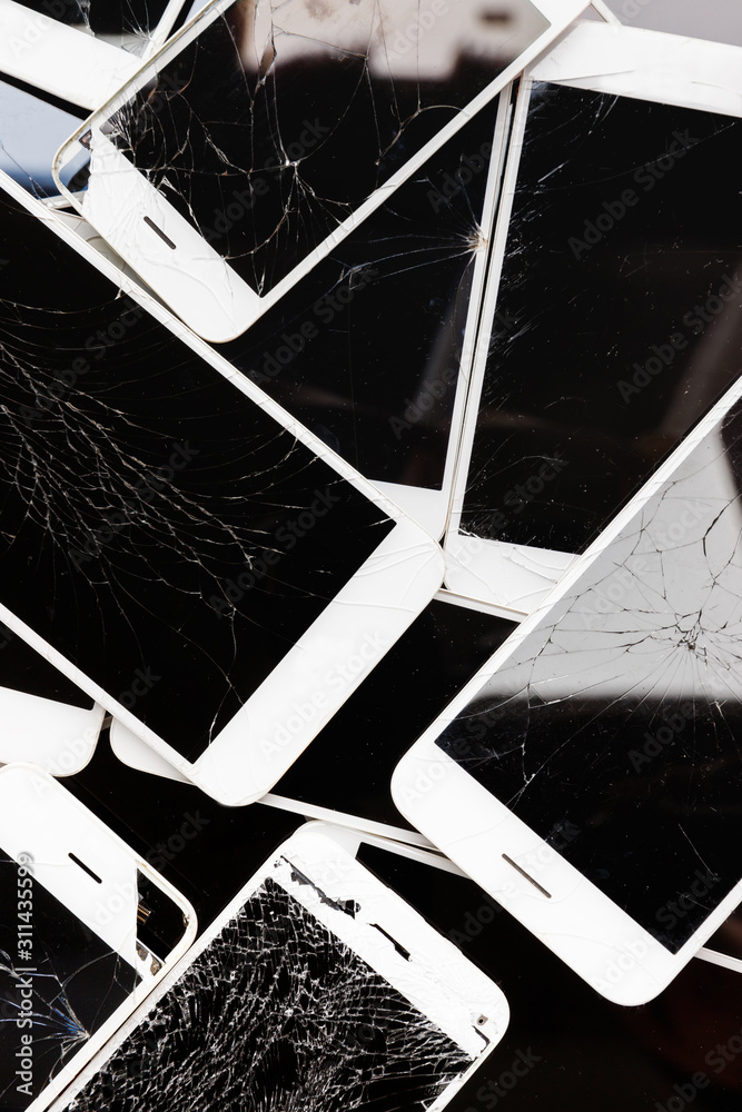 Close up of piles of cracked/broken screen/glass of mobile phone, top ...