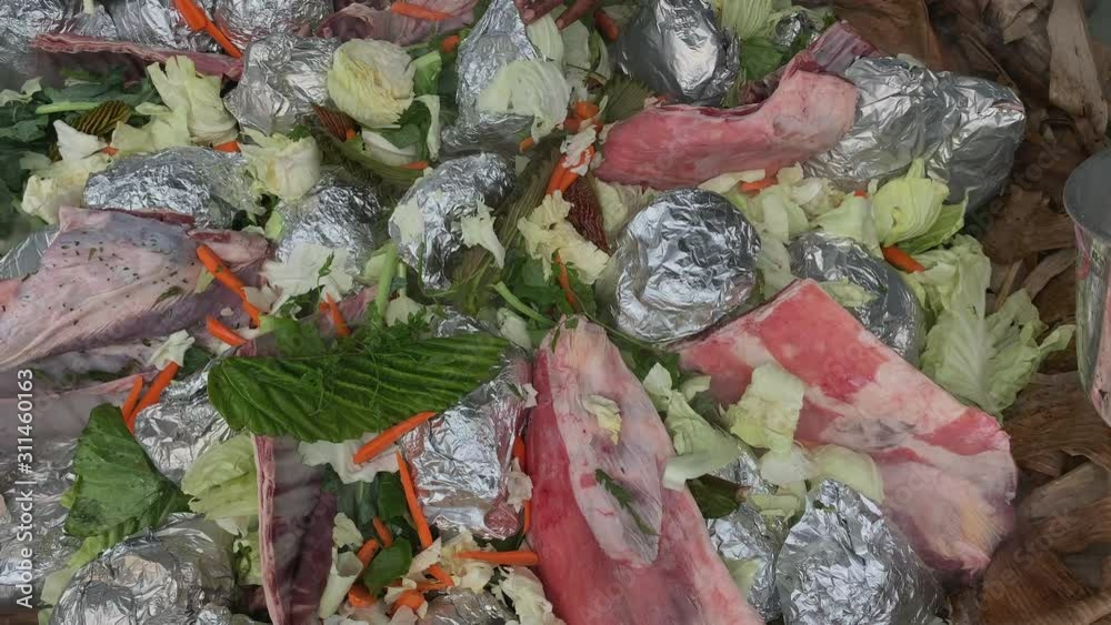 Mumu, traditional method of cooking large quantities of food for ...