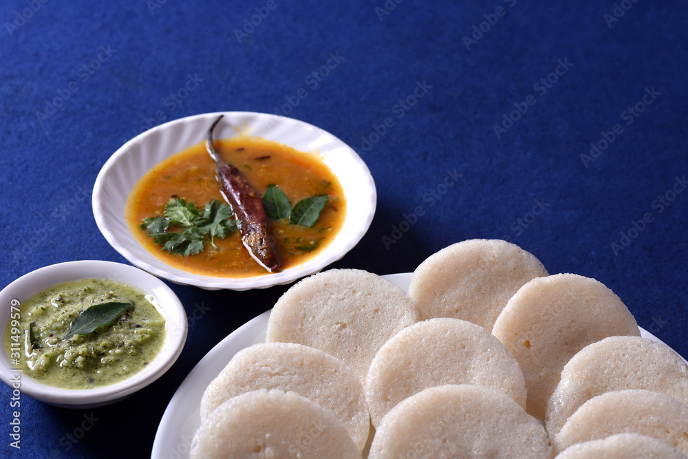 Idli with Sambar and coconut chutney on blue background, Indian Dish ...