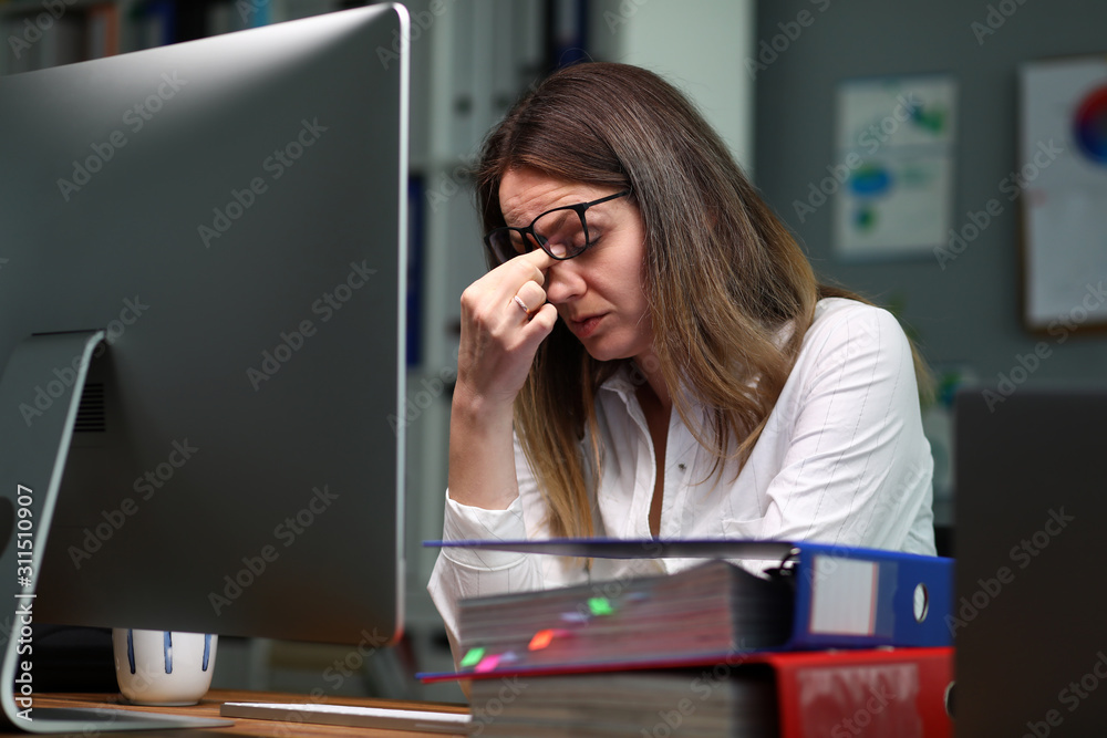 Tired employee in company office Stock Photo | Adobe Stock