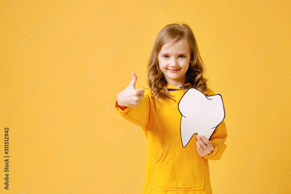 Little girl blond Brushing Teeth Holding Papercraft Tooth Stock Photo ...