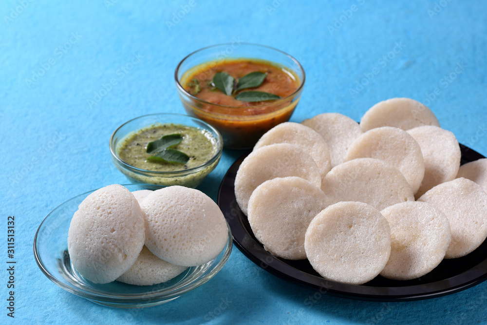 Idli with Sambar and coconut chutney on blue background, Indian Dish ...