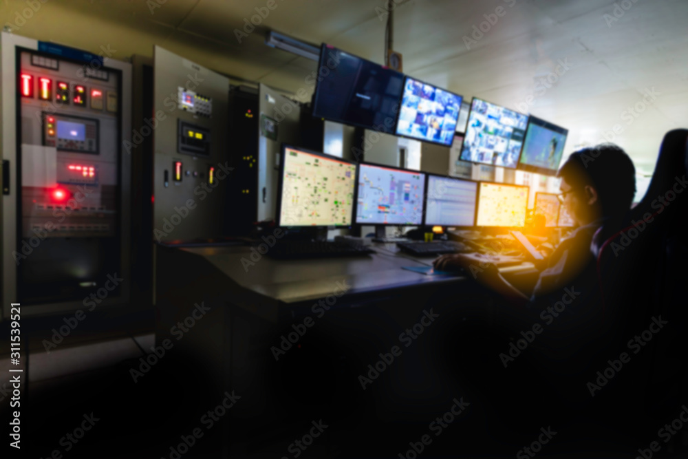 Blurred of man engineer works with the tablet in the production control ...