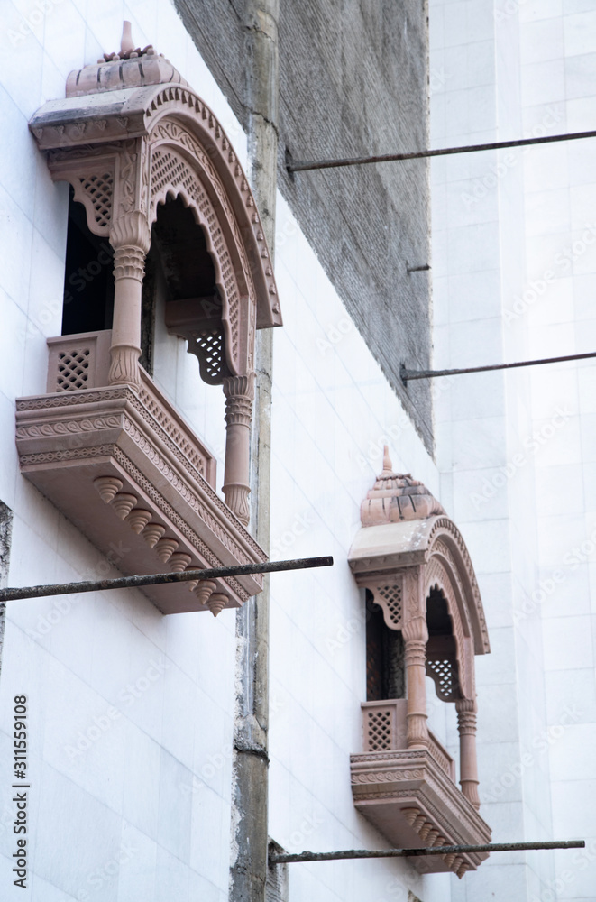 decorated windows, columns and arches in the Indian temple under ...