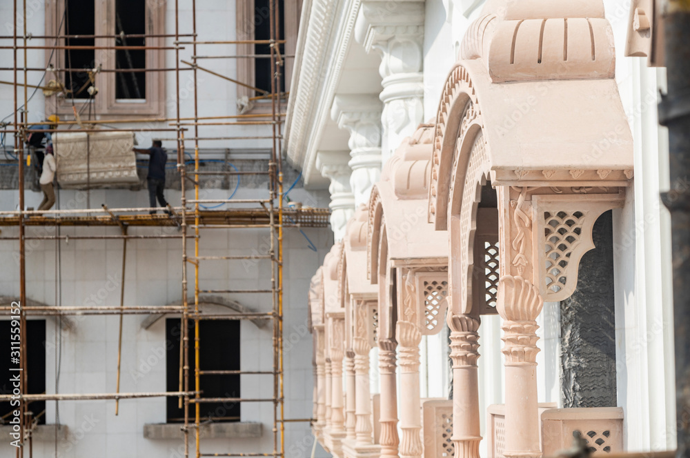 decorated windows, columns and arches in the Indian temple under ...
