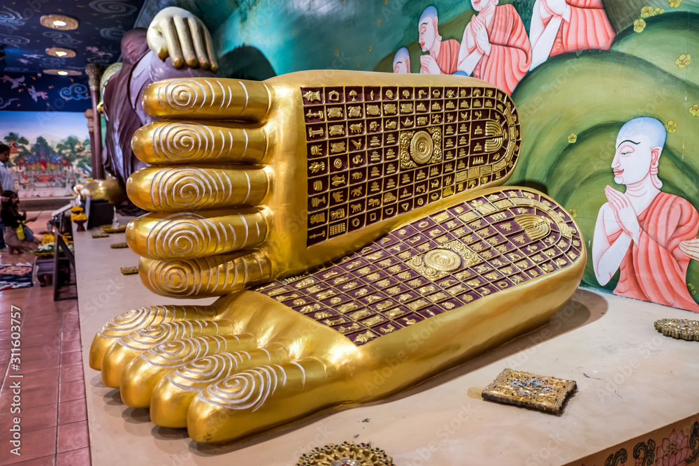 Feet of Buddha statue in the Buddhist temple of Thailand. detailed feet ...