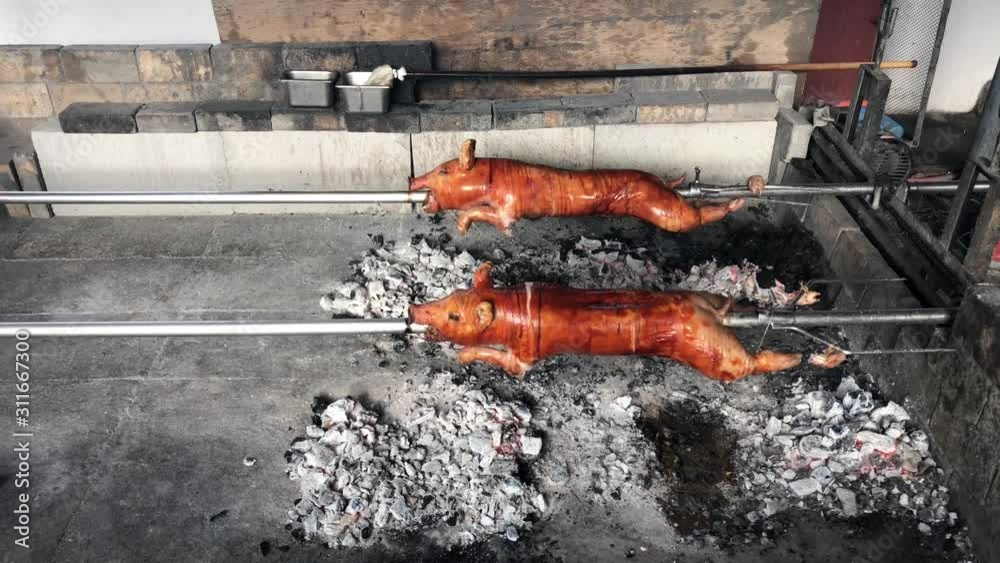 Full suckling pig roasted on the fire. Lechon Filipino BBQ Food Stock ...