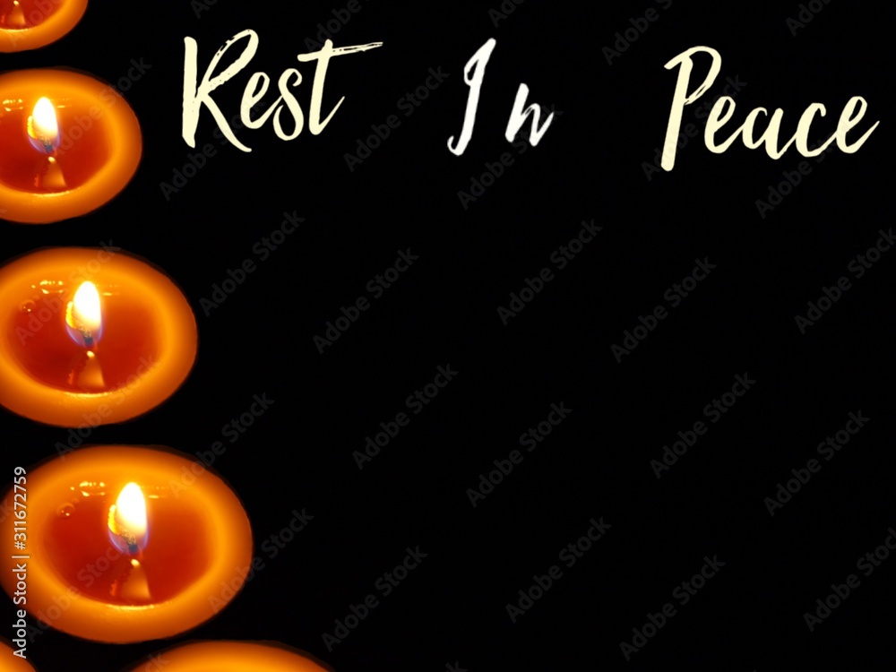 Many yellow light candle with word "Rest in Peace" (RIP) isolated on ...