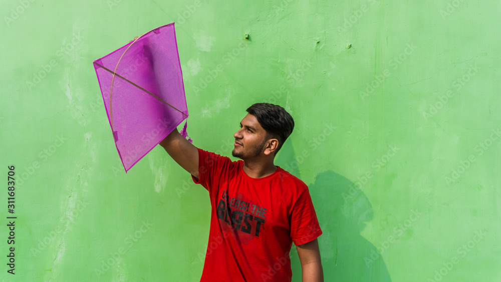 Young man with Patang(kite) for Makar Sankranti festival of India ...