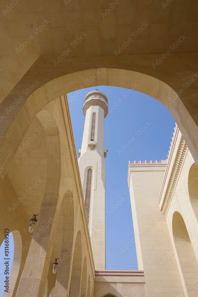 Traditional architecture of tower over sky from inside of grand mosque ...