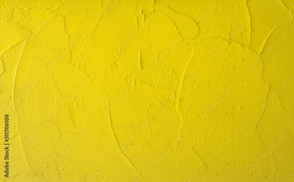 Yellow mustard pastel color of rough surface mortar concrete wall with ...