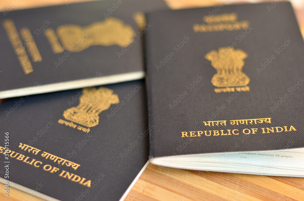 Zdjęcie Stock: Multiple Indian Passports kept against wooden background ...