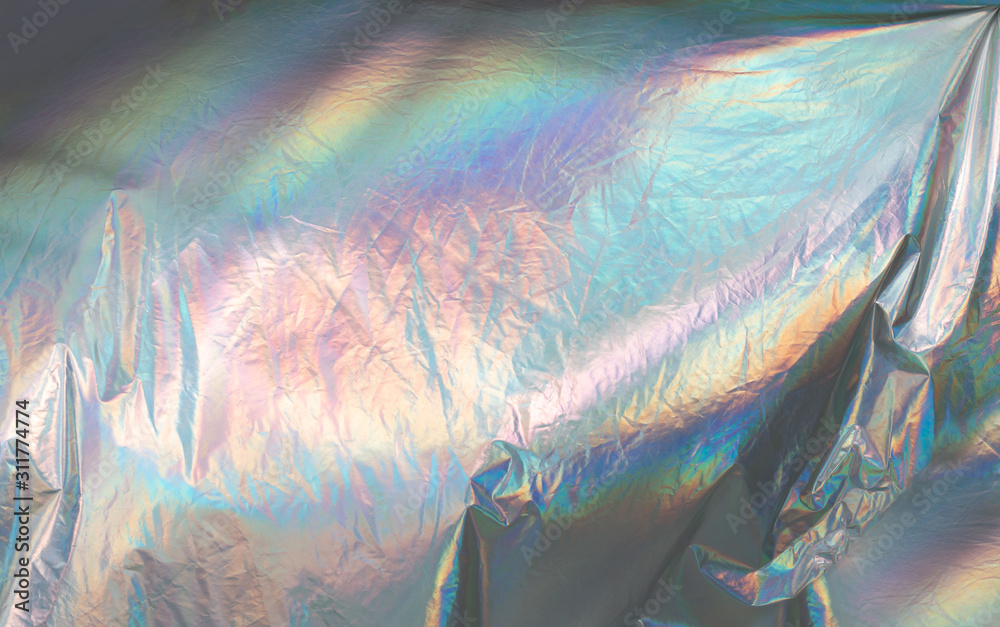 iridescent holographic fabric. sparkling background with waves and ...