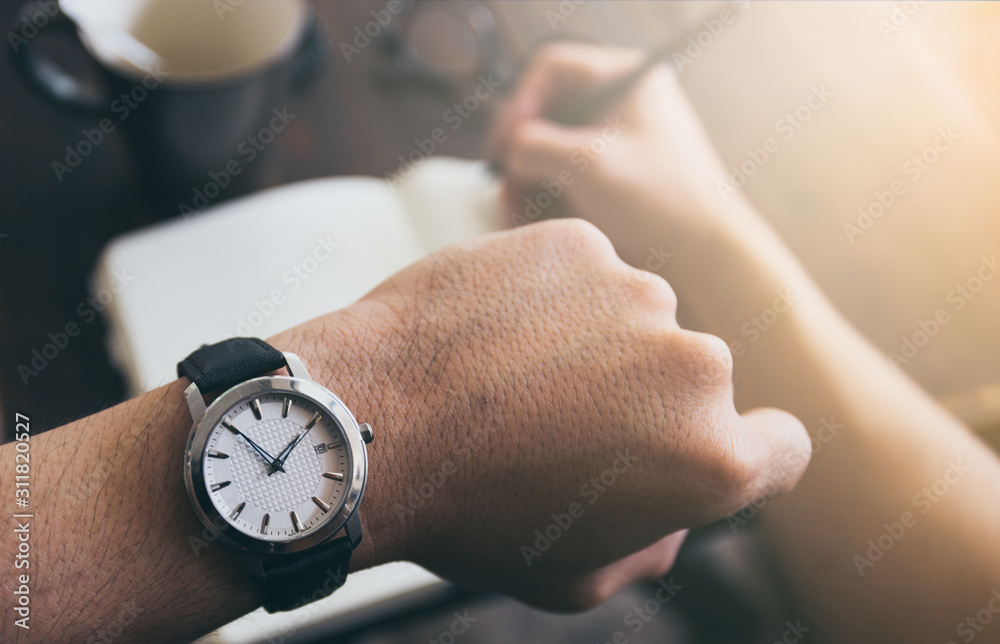 looking at luxury watch on hand check the time.concept for managing ...