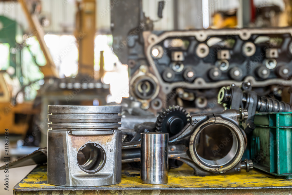 Piston of the diesel engine on working table Stock Photo | Adobe Stock