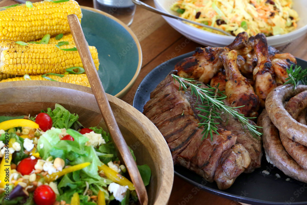 colourful barbeque braai plated meal consisting of chicken, steak ...
