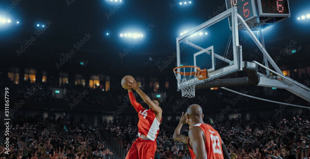 Basketball players on big professional arena during the game. Tense ...