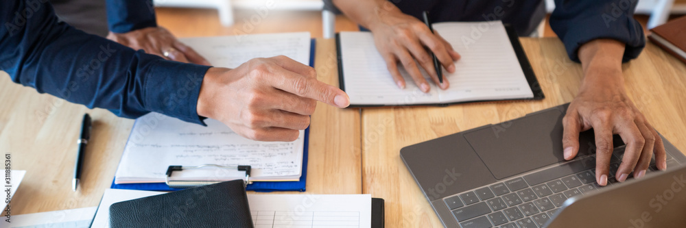 Young students classmates help friend catching up workbook and learning ...