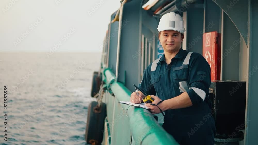 Marine chief officer or chief mate on deck of ship or vessel. He fills ...