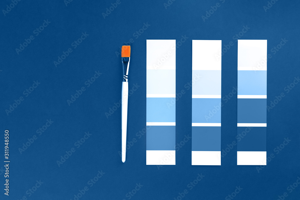 Shades of trending blue sea color swatches with a white brush on ...