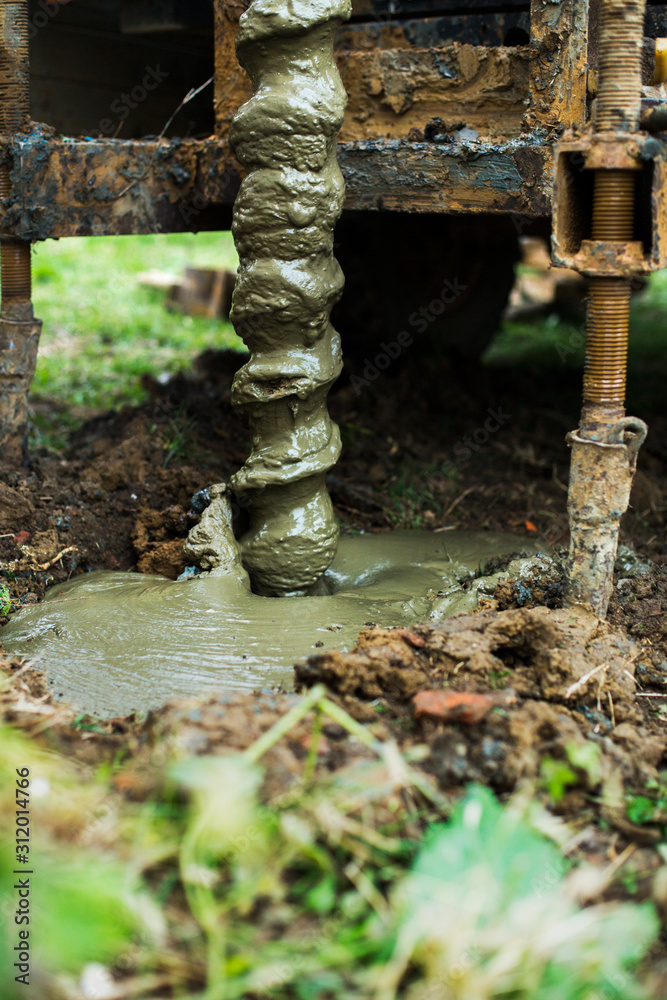 Drilling a water borehole. Ground water hole drilling machine installed ...