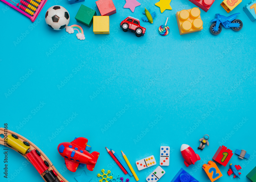 Kids toys on blue background with copy space Stock Photo | Adobe Stock