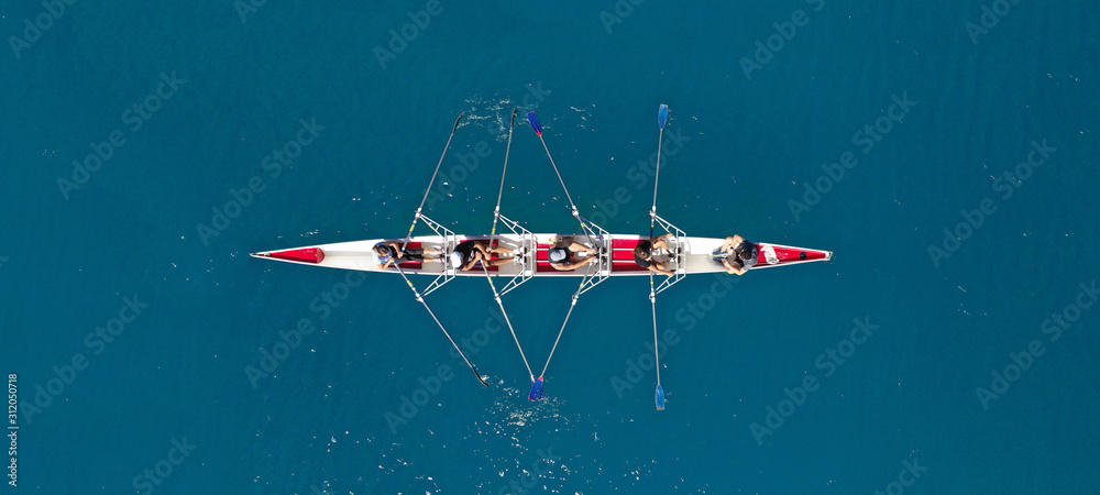 Aerial drone ultra wide photo of sport canoe with young team of ...