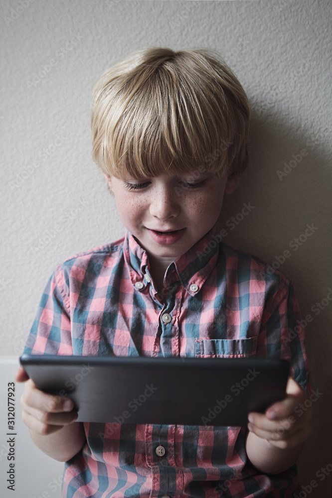 Young Boy on Tablet Stock Photo | Adobe Stock