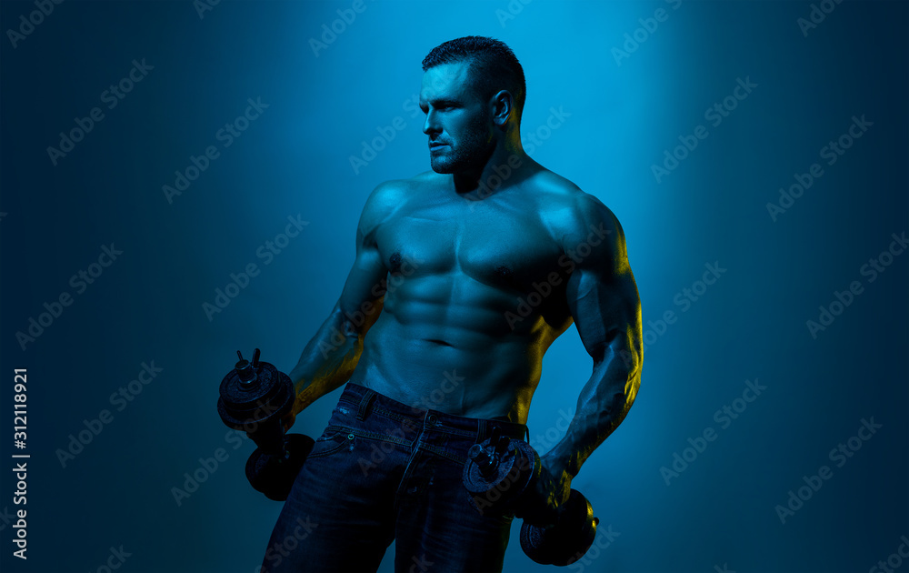 Bodybuilder. Strong bodybuilder man with perfect abs, biceps and chest ...