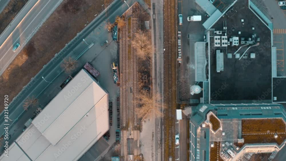 a birds eye view of a industrial zone. Forward flight over a train ...