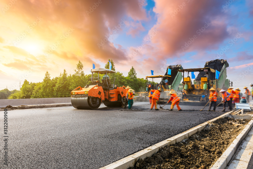 Construction site is laying new asphalt road pavement,road construction ...