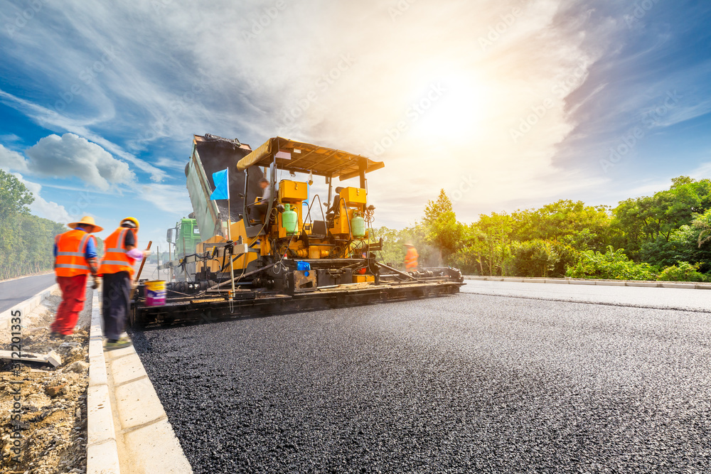 Construction site is laying new asphalt road pavement,road construction ...