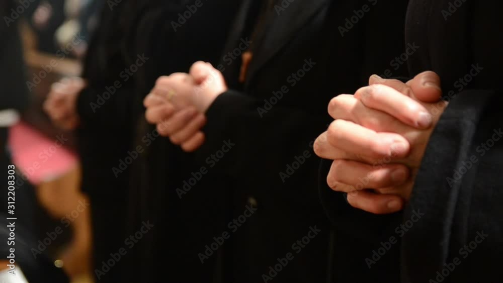 Video Stock Praying hands of christian women praying in Cathedral ...