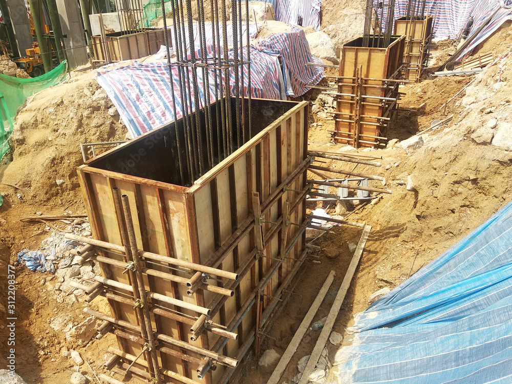Pile cap and column stump under construction at the construction site ...