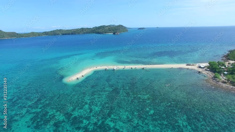 Long thin naturally occurring sandbank shoal or narrow beach sand ...
