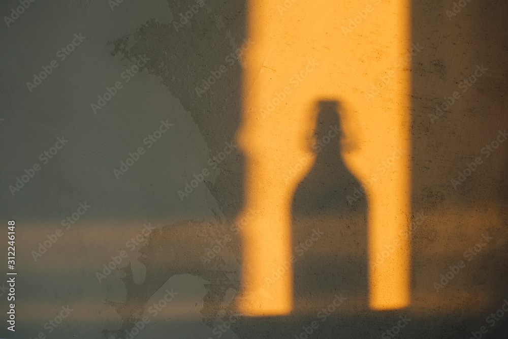 Shadow of glass water bottle at concrete wall texture background. Stock ...
