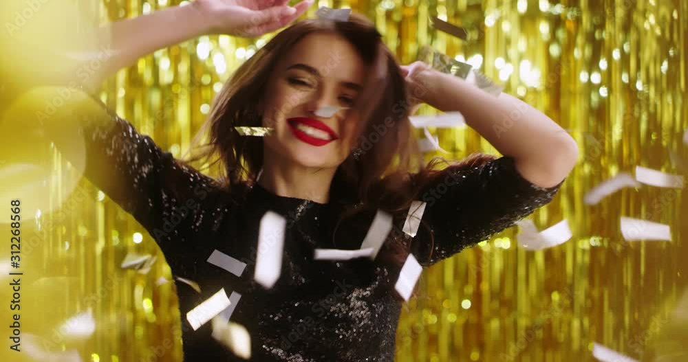 Young Caucasian happy woman celebrity with red lips and in black fancy ...