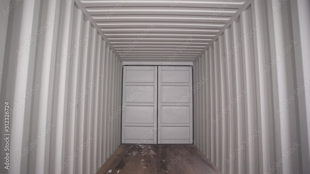 Inside large shipping container. Stock footage. View from inside locked ...