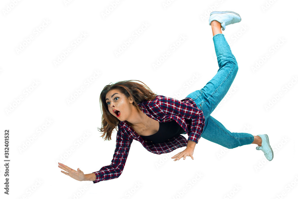 A second before falling. Caucasian young girl falling down in moment ...