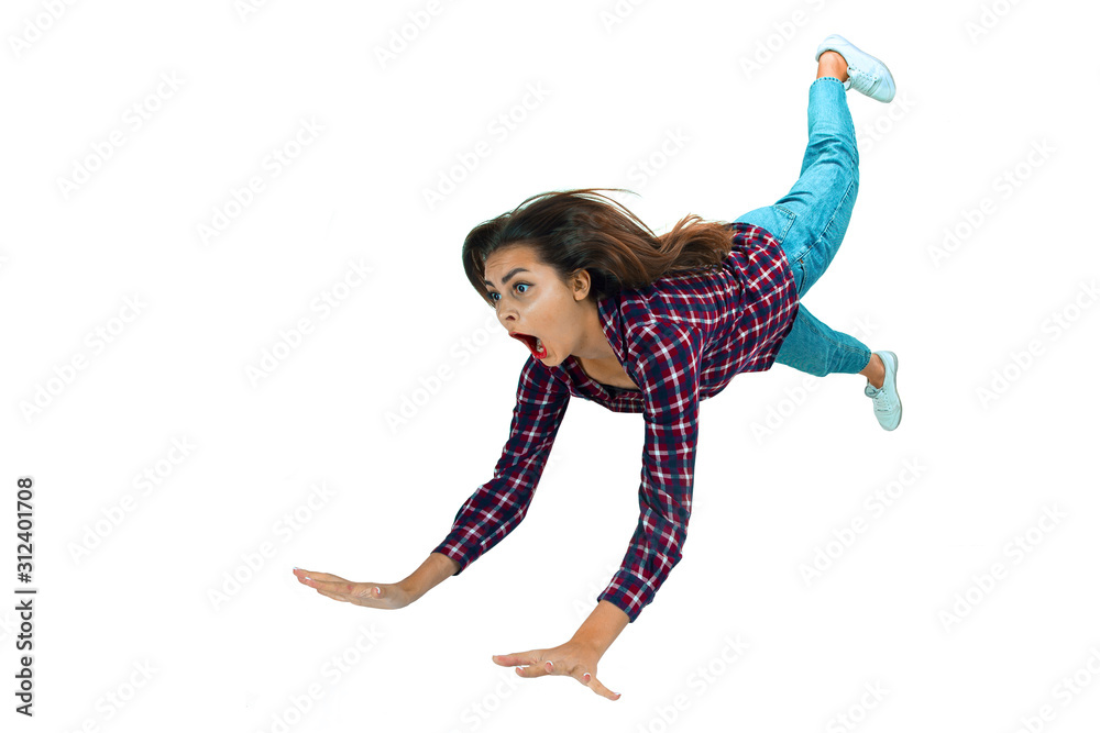 A second before falling. Caucasian young girl falling down in moment ...