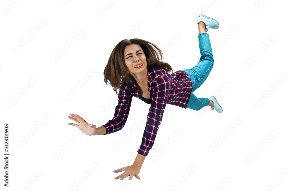 A second before falling. Caucasian young girl falling down in moment ...