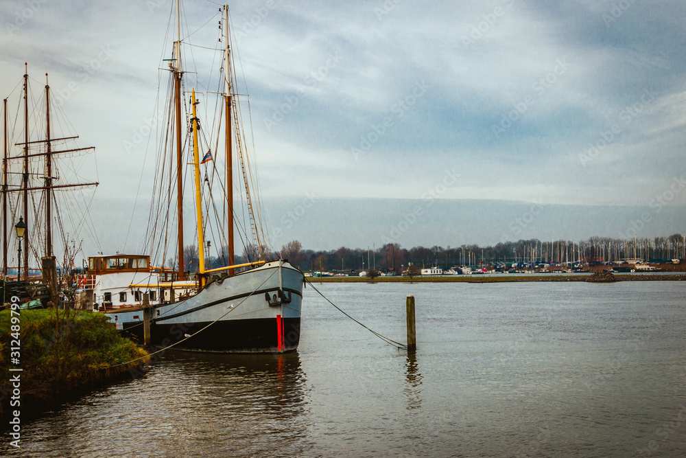 City view and skyline with beautiful medieval houses and ships at the ...