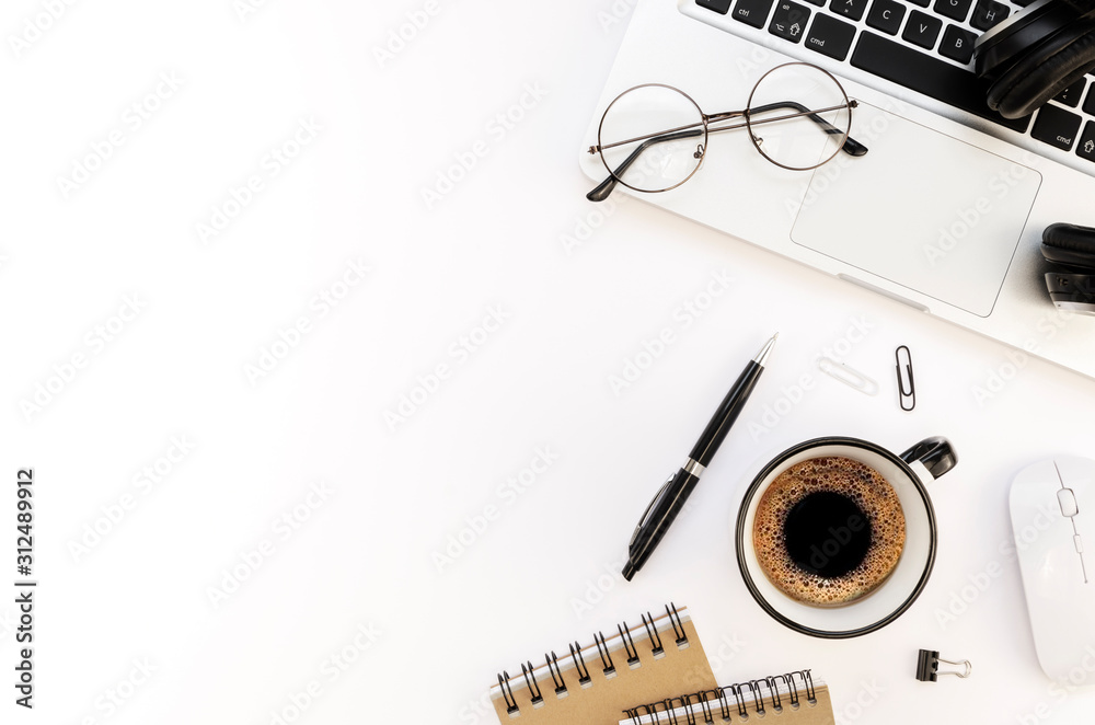 Flat lay programmer's workplace white table with silver laptop and ...