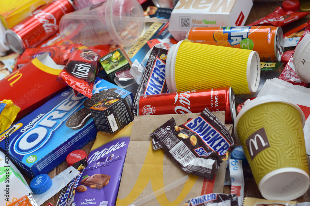 Big pile of many disposable colored trash from edible products of ...