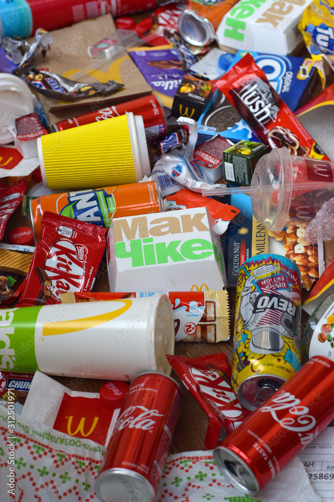 Big pile of many disposable colored trash from edible products of ...